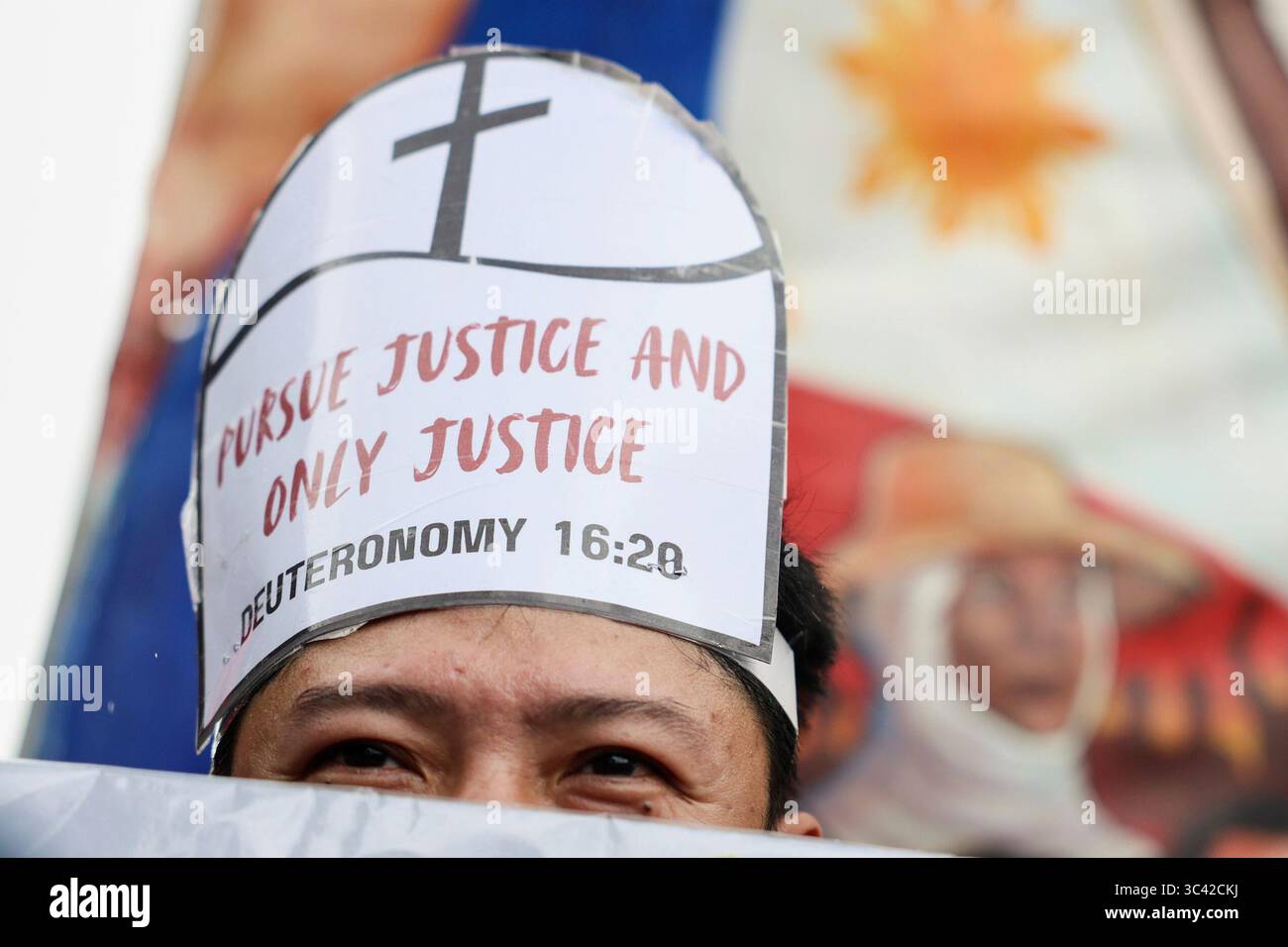 A man wears a slogan during a protest in time for Philippines President ...