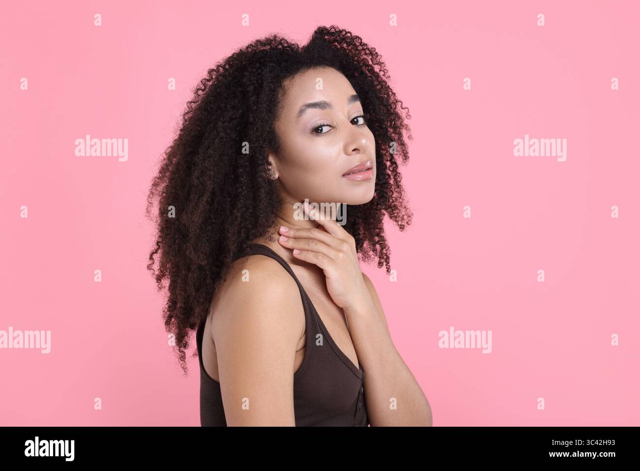 Beautiful Brazilian woman with healthy skin on pink background Stock ...