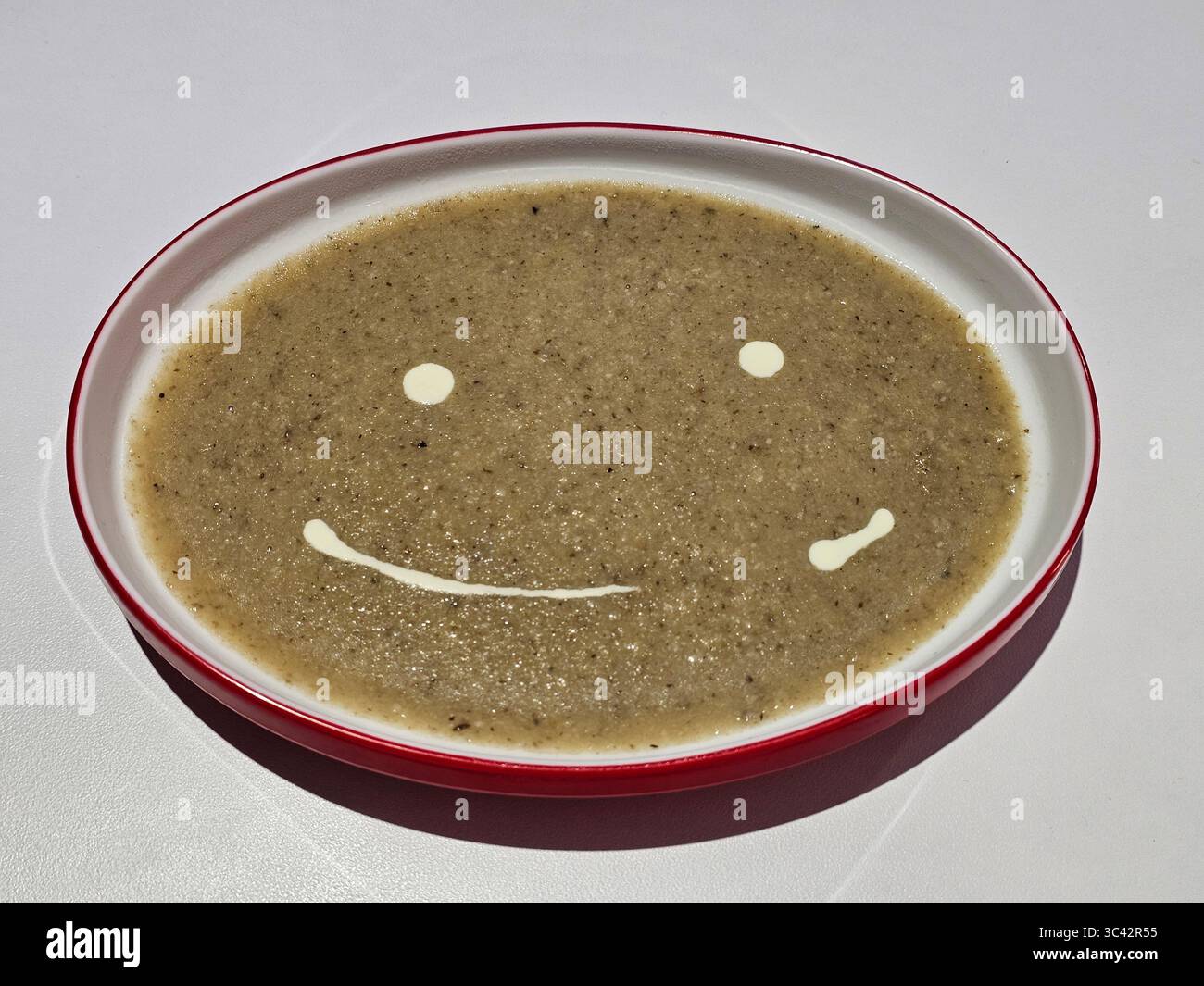 Smiling Mushroom Soup Stock Photo - Alamy