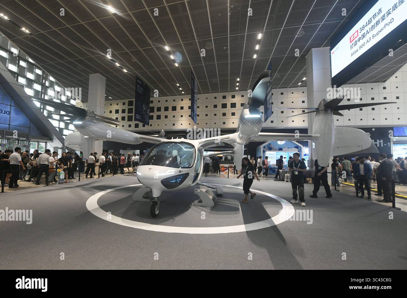 SHANGHAI, CHINA - JULY 26, 2025 - Visitors to the E20 Electric Vertical Take-off and landing ...
