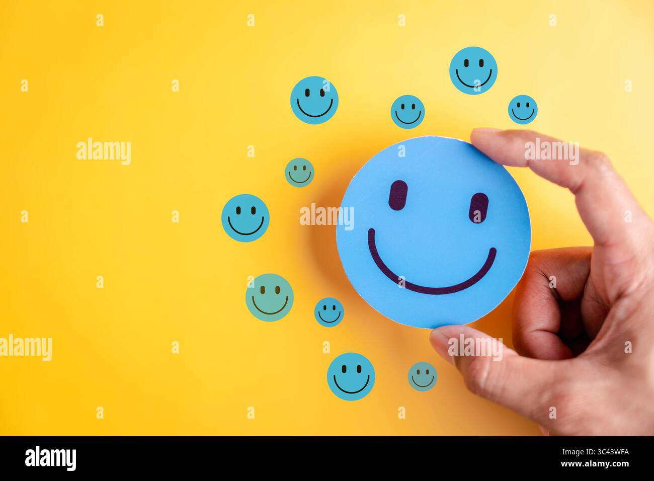 Positive emotion and mental health. smiley face surrounded by multiple ...
