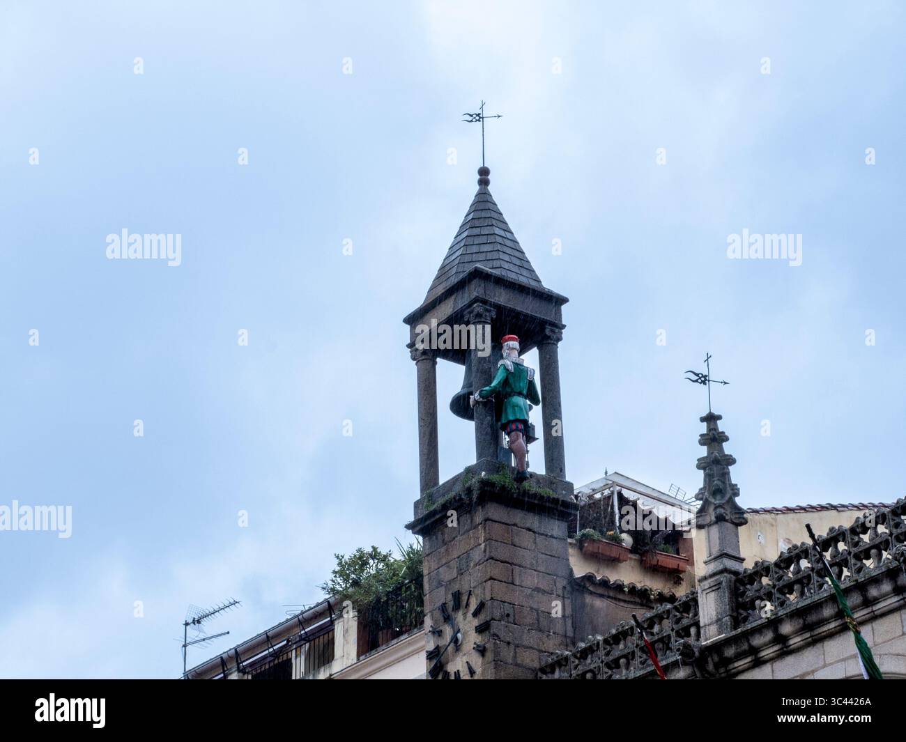 Traditional jacquemart automaton striking a bell in a clock tower in ...