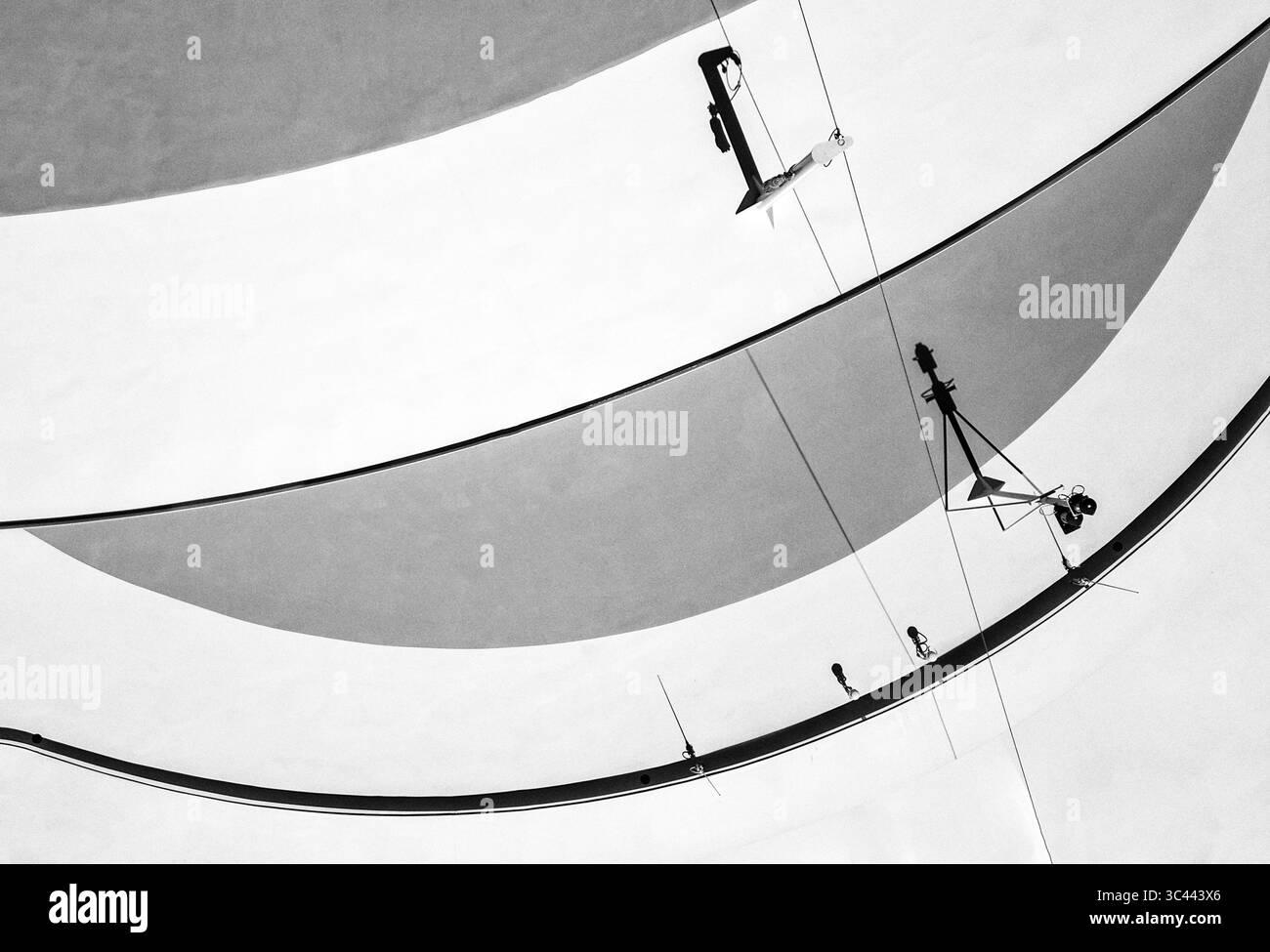 Aerial view of yachts sailing, their sails billowing in the wind ...