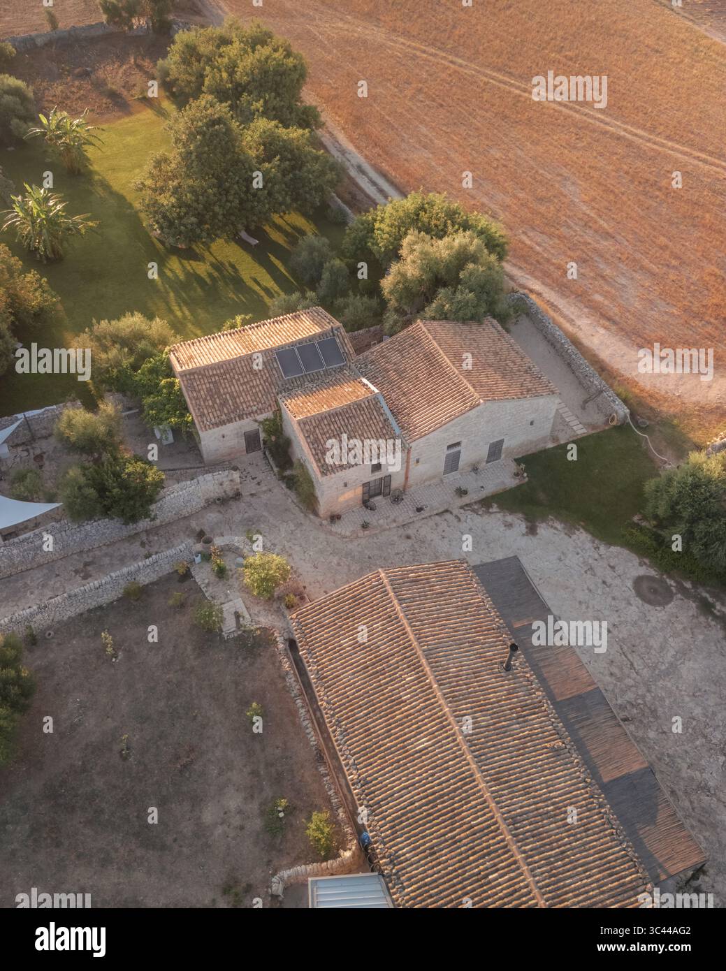 Aerial view of the rustic buildings of Rifugio Lanzagallo bask in the ...