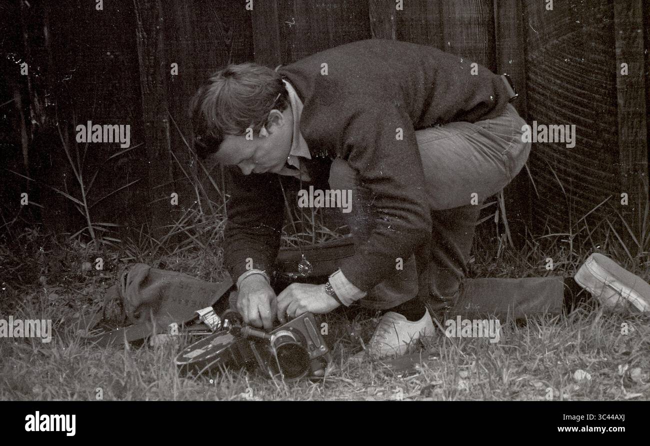 June 17, 1967, Monterey, California, USA: Man Kneeling, Fixing Camera ...