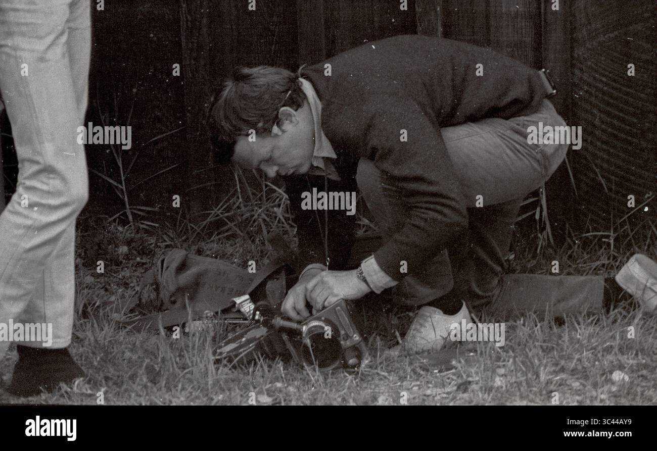 June 17, 1967, Monterey, California, USA: Man Kneeling with Camera at ...