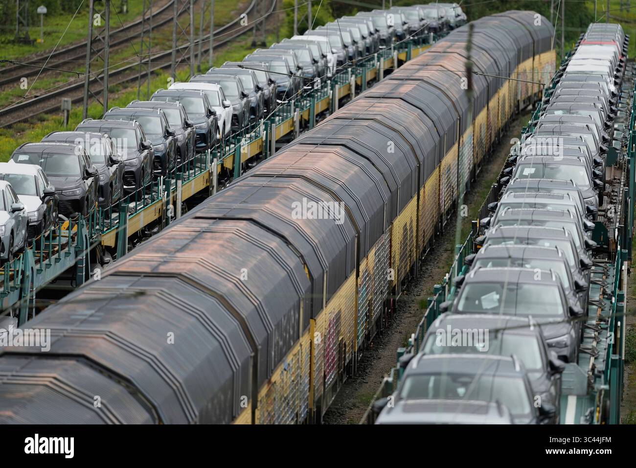 New cars of German car manufacturer Volkswagen and Audi are parked on a ...
