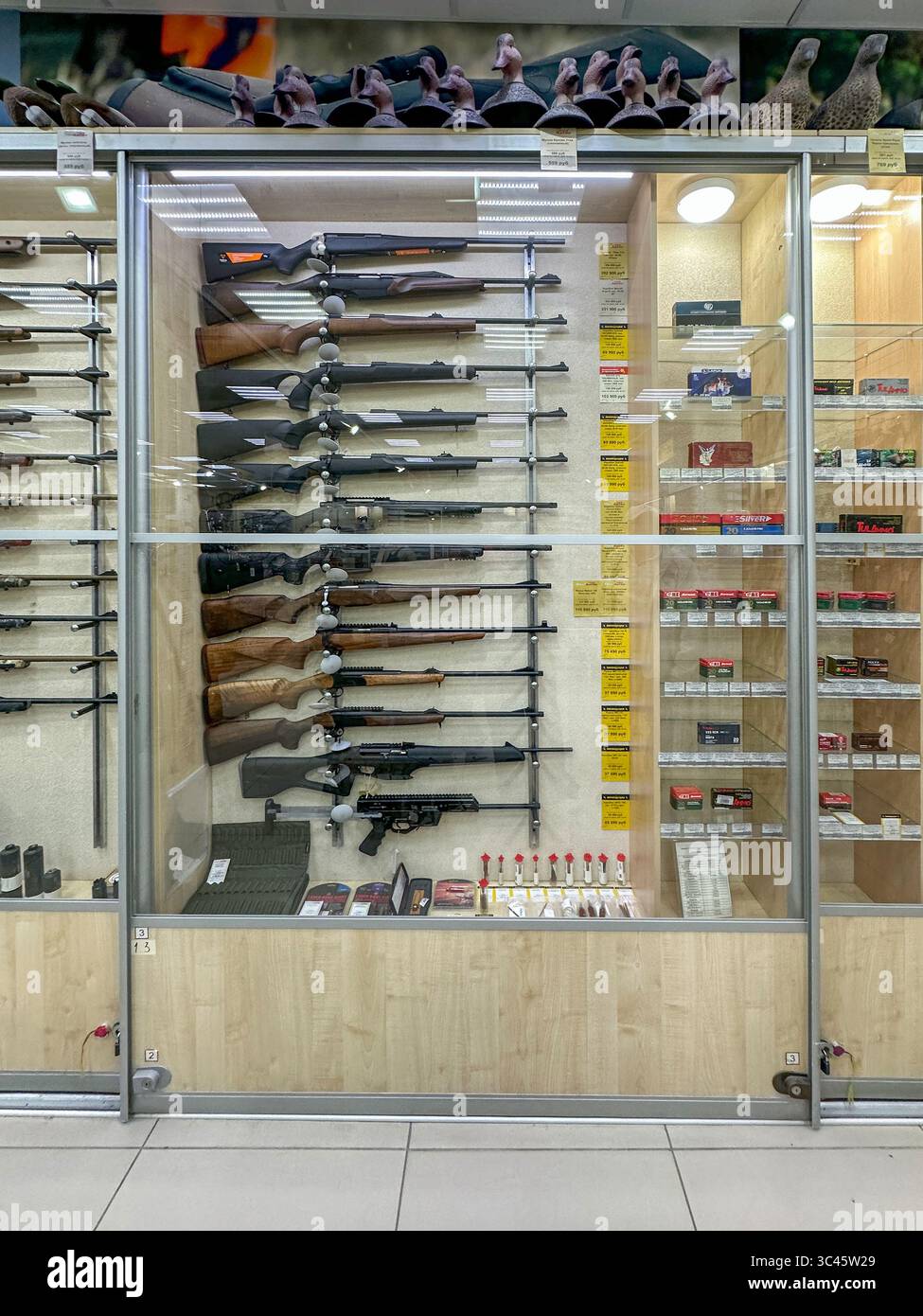 Hunting rifles on display at a gun and hunting store. June 28, 2025 ...