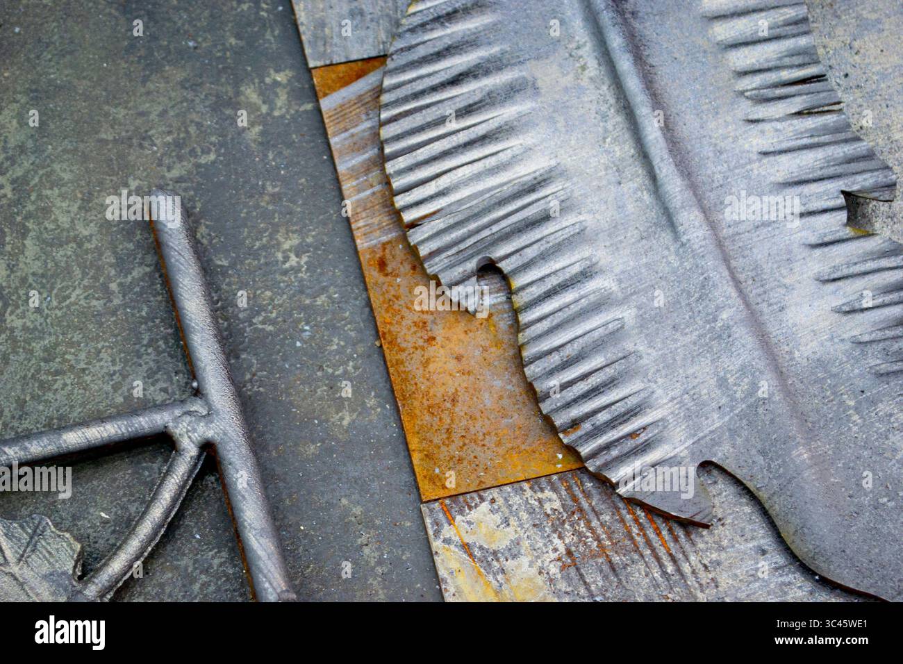 Sheet metal after laser cleaning of rust. A piece of metal after laser ...