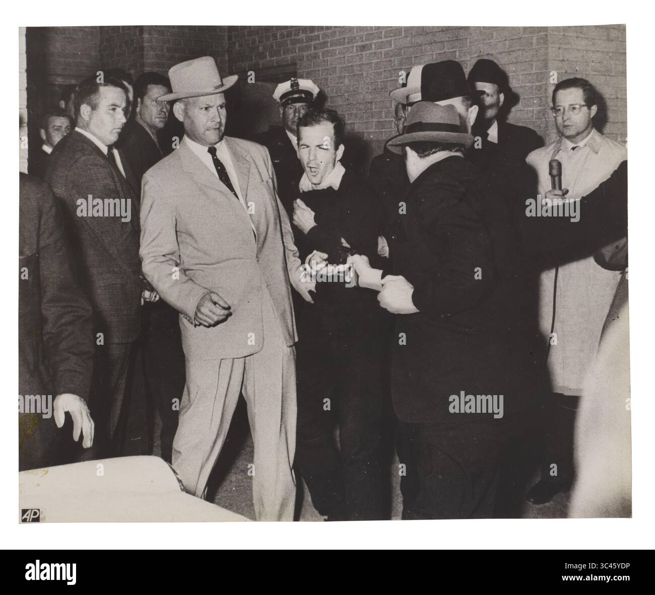 Jack Ruby (52) shoots Lee Harvey Oswald (24). Winner of the 1964 ...