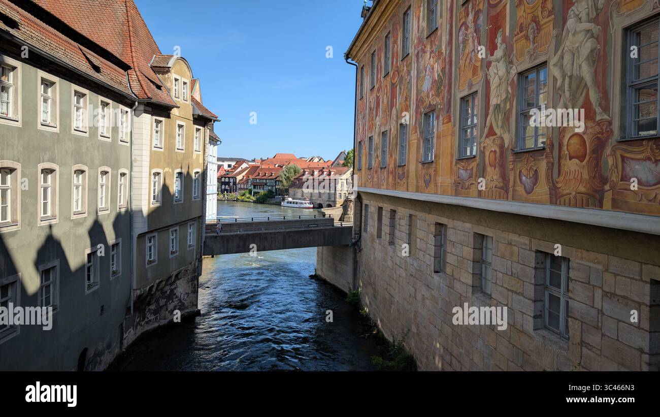 Historic buildings connect by bridges across the Regnitz River in ...