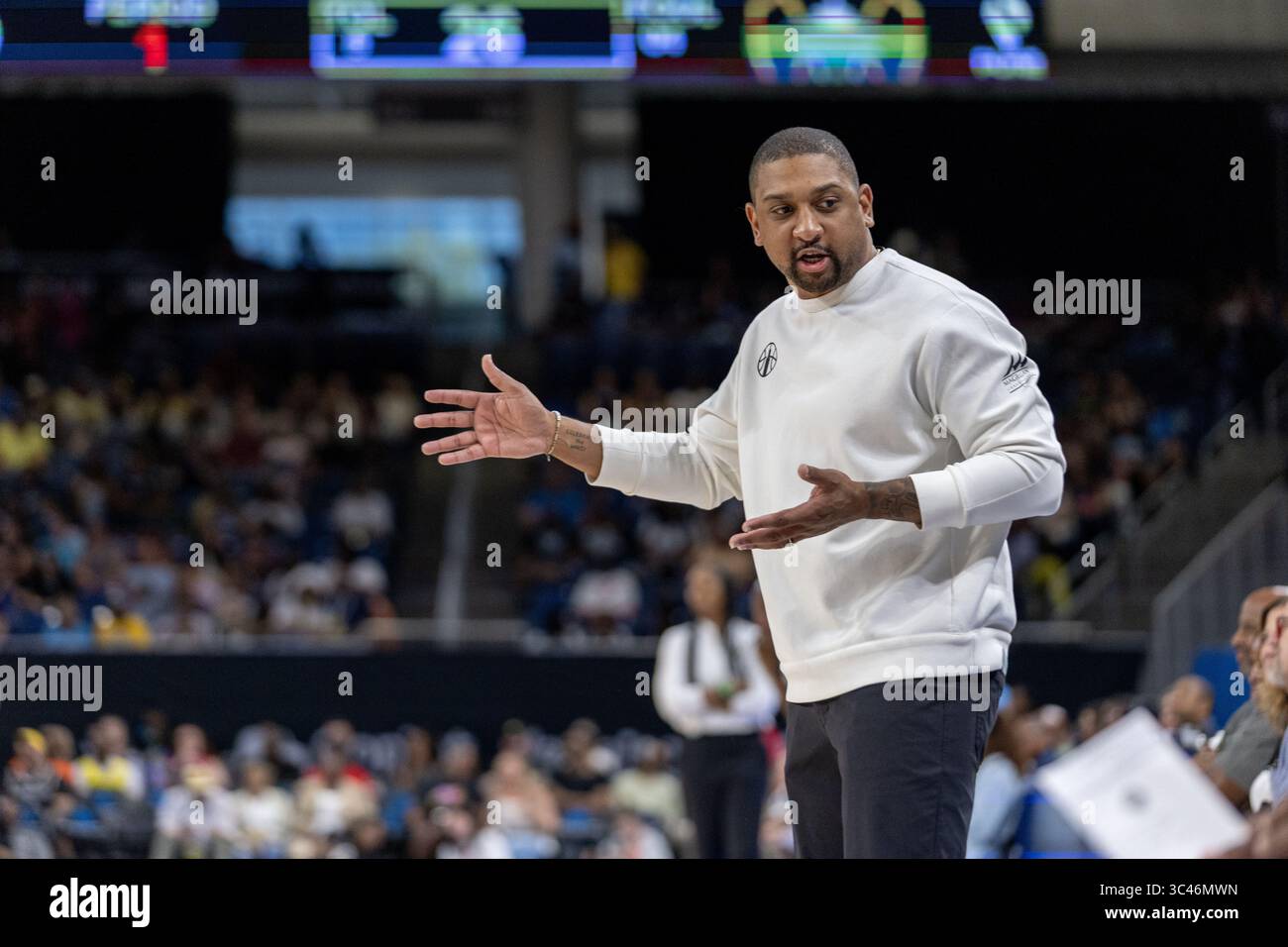 Chicago Sky Head Coach Tyler Marsh talks to someone on the bench during ...