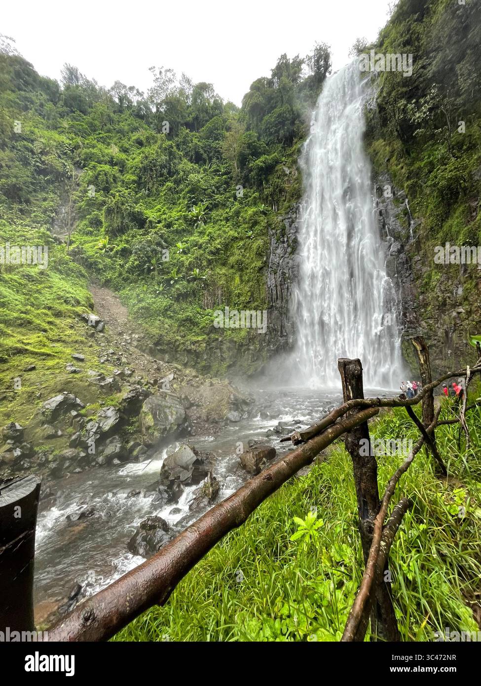 A breathtaking view of Materuni Waterfall cascading down a verdant ...