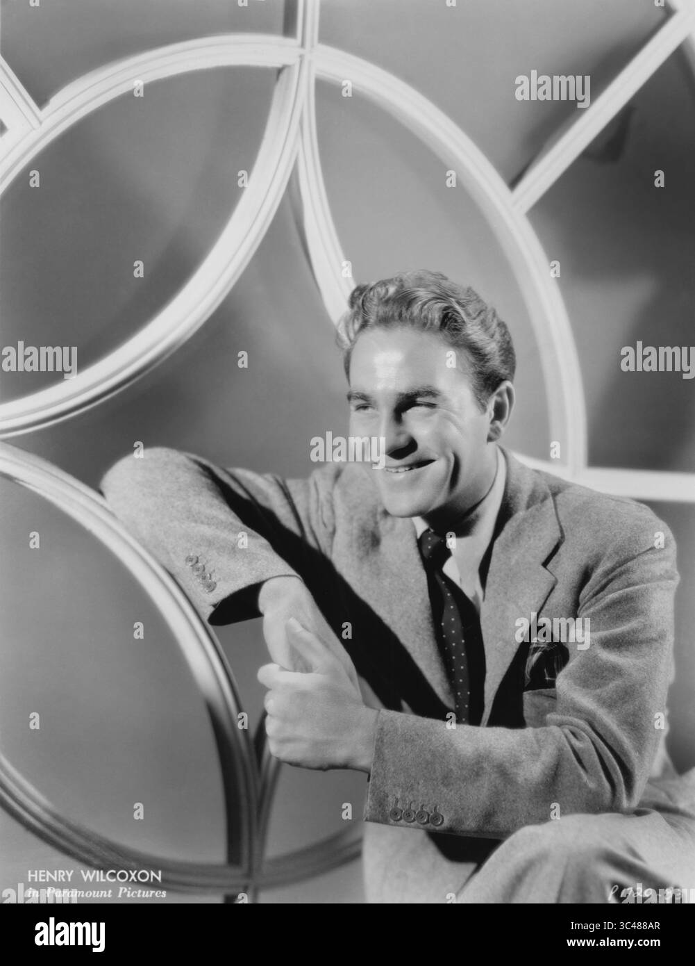 Smiling celebrity sitting Black and White Stock Photos & Images - Alamy