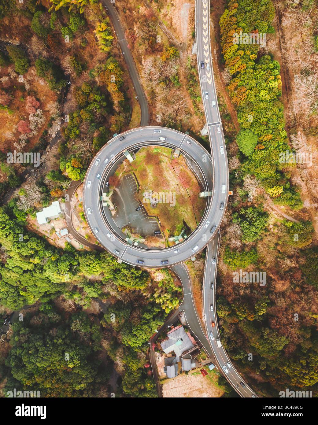 Aerial view of the Kawazu Nanadaru Loop Bridge, a concrete swirl amid ...