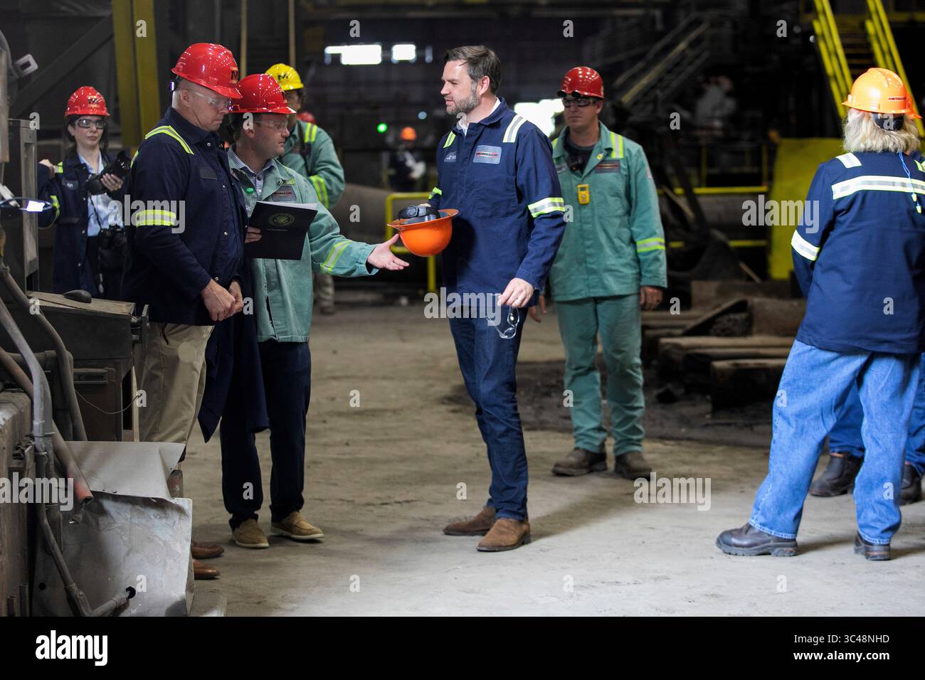 Vice President JD Vance greets workers as he tours the Metallus plant ...
