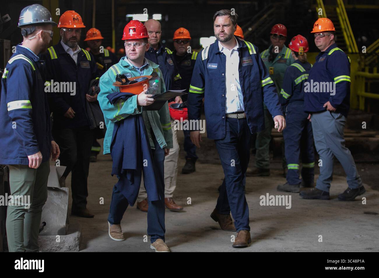 Vice President JD Vance, foreground at right, tours the Metallus plant ...