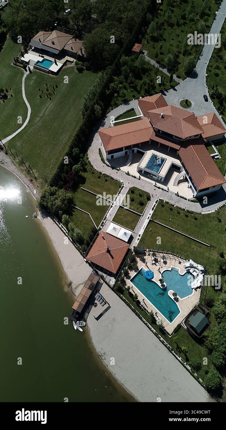 Aerial view of a countryside resort on Pavlovac Lake, Serbia. Villas ...
