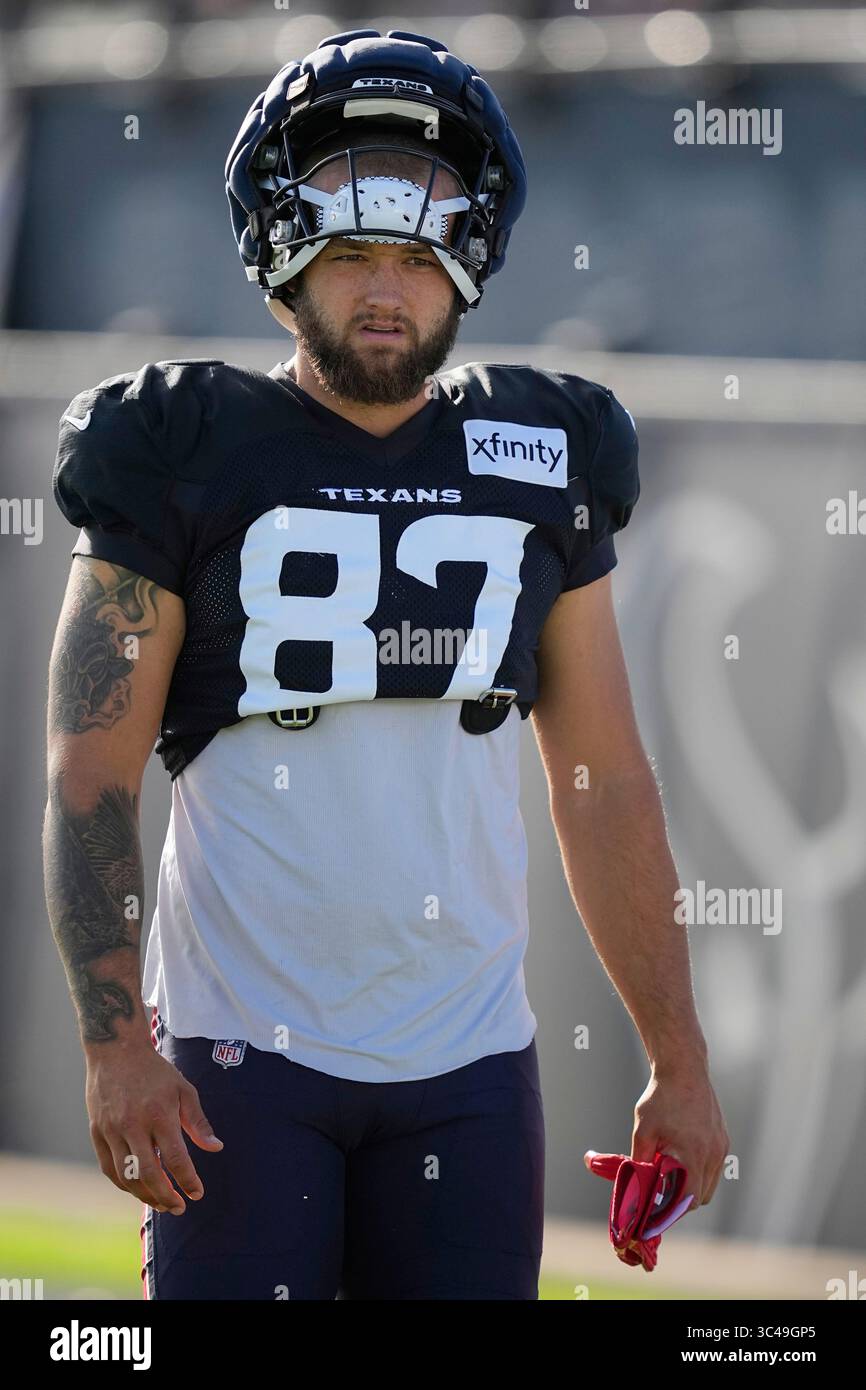 Houston Texans tight end Cade Stover walks across the field before an ...