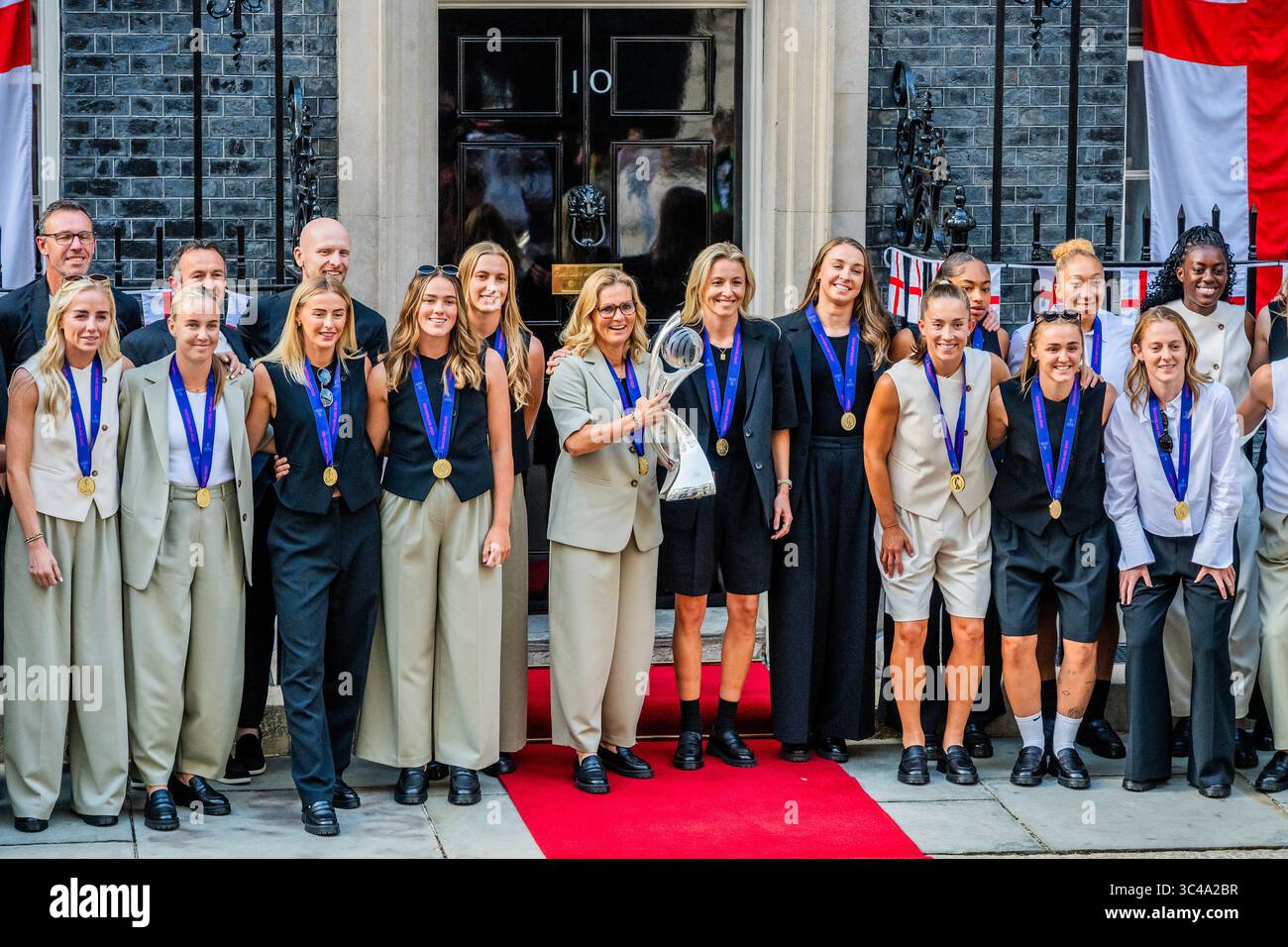 London, UK. 28th July, 2025. Sarina Wiegman, Manager, holds up the ...