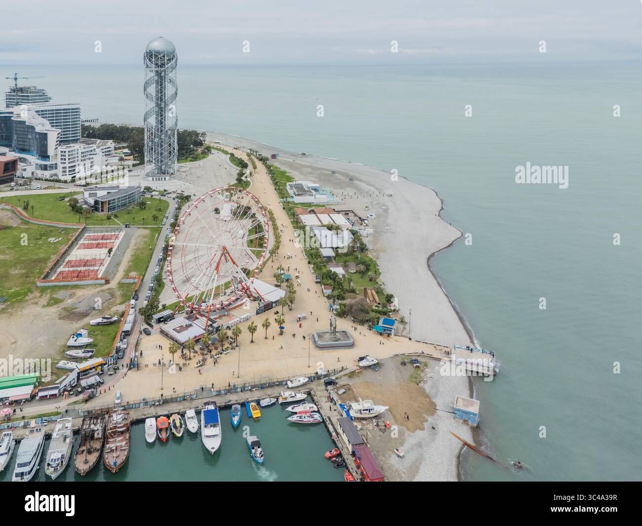 Aerial view of the dramatic Alphabet Tower and the bustling Batumi pier ...