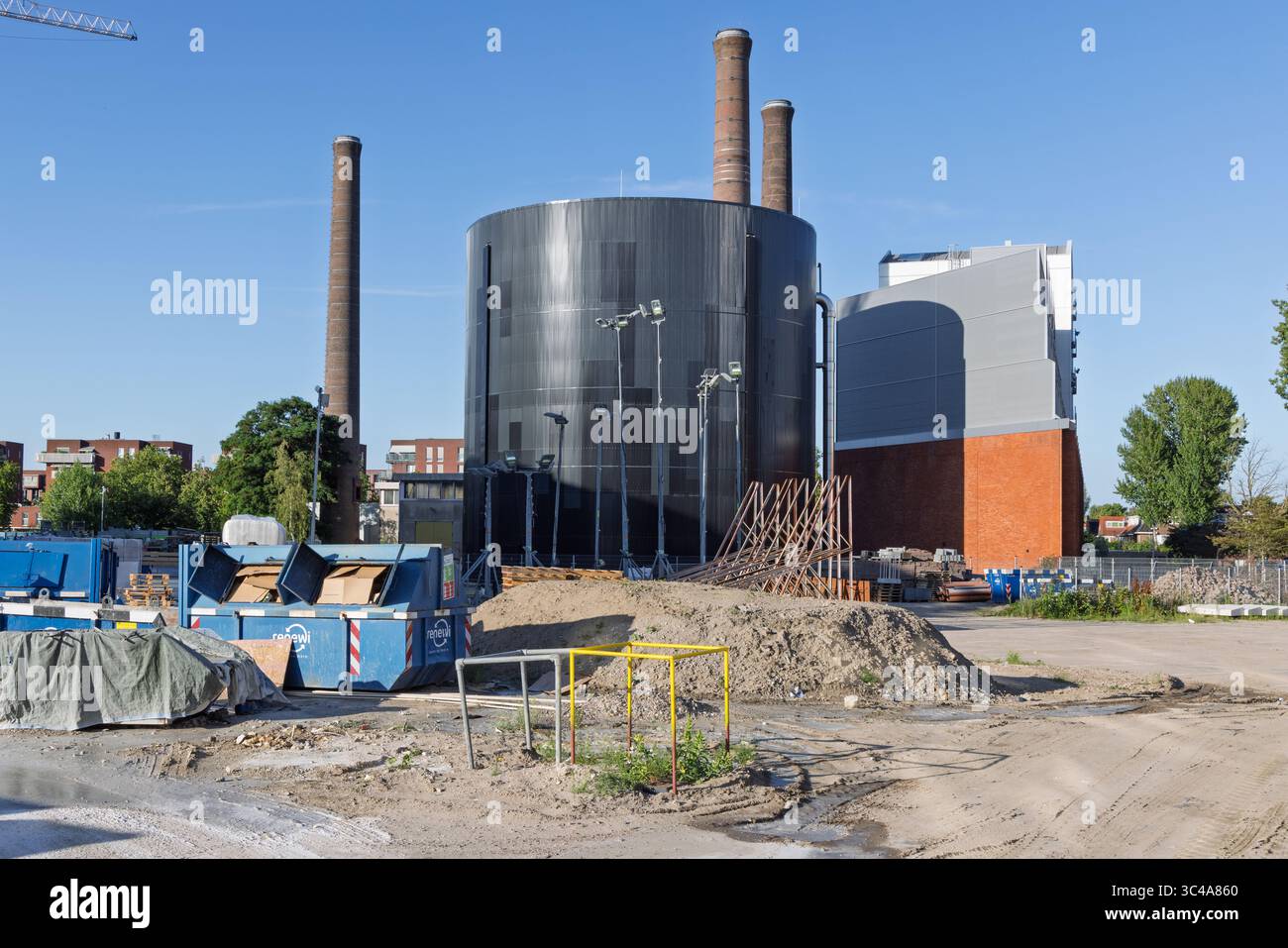 Industrial heating plant with tall chimneys and modern facilities on a ...