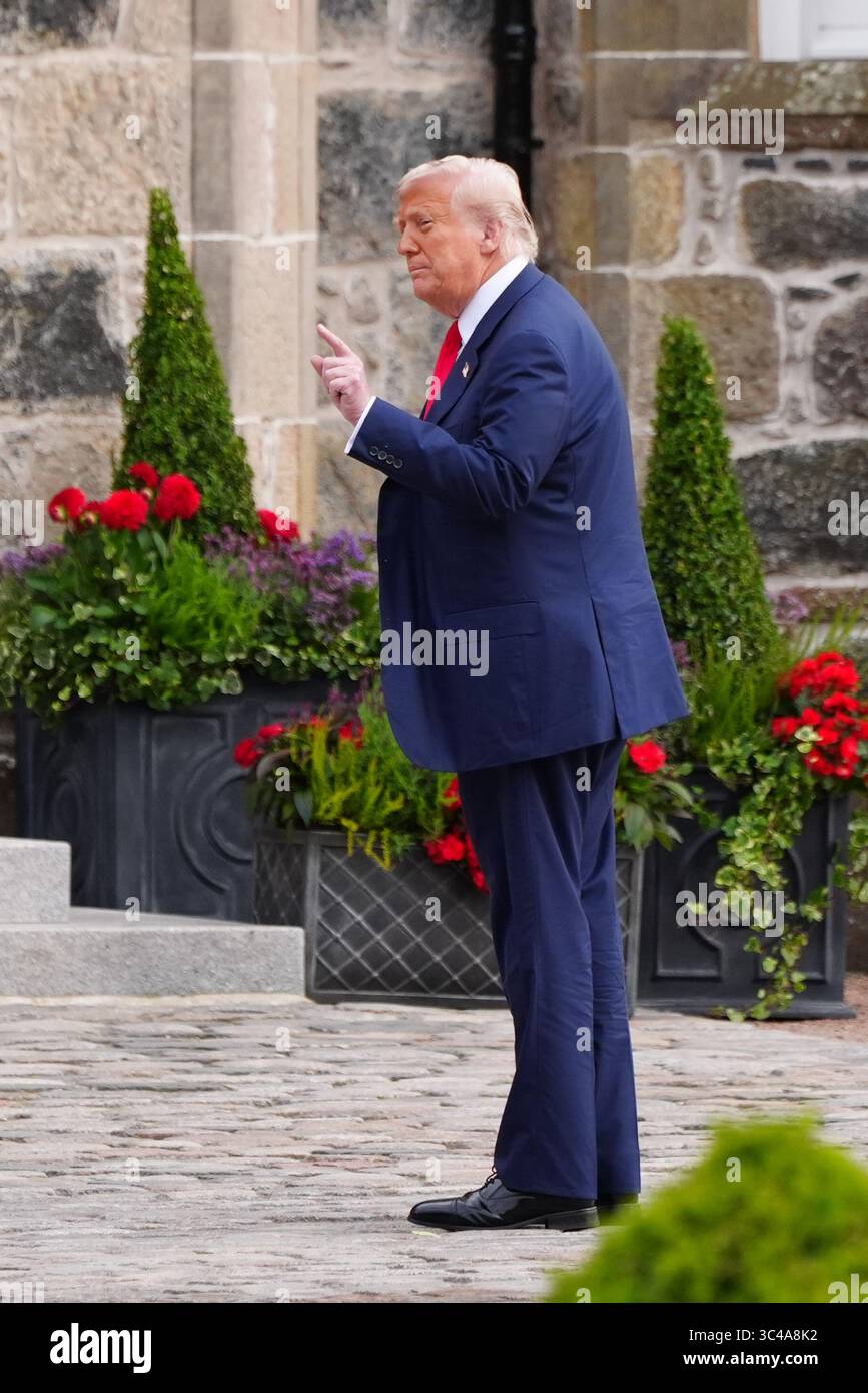 US President Donald Trump arrives at Trump International Golf Links ...
