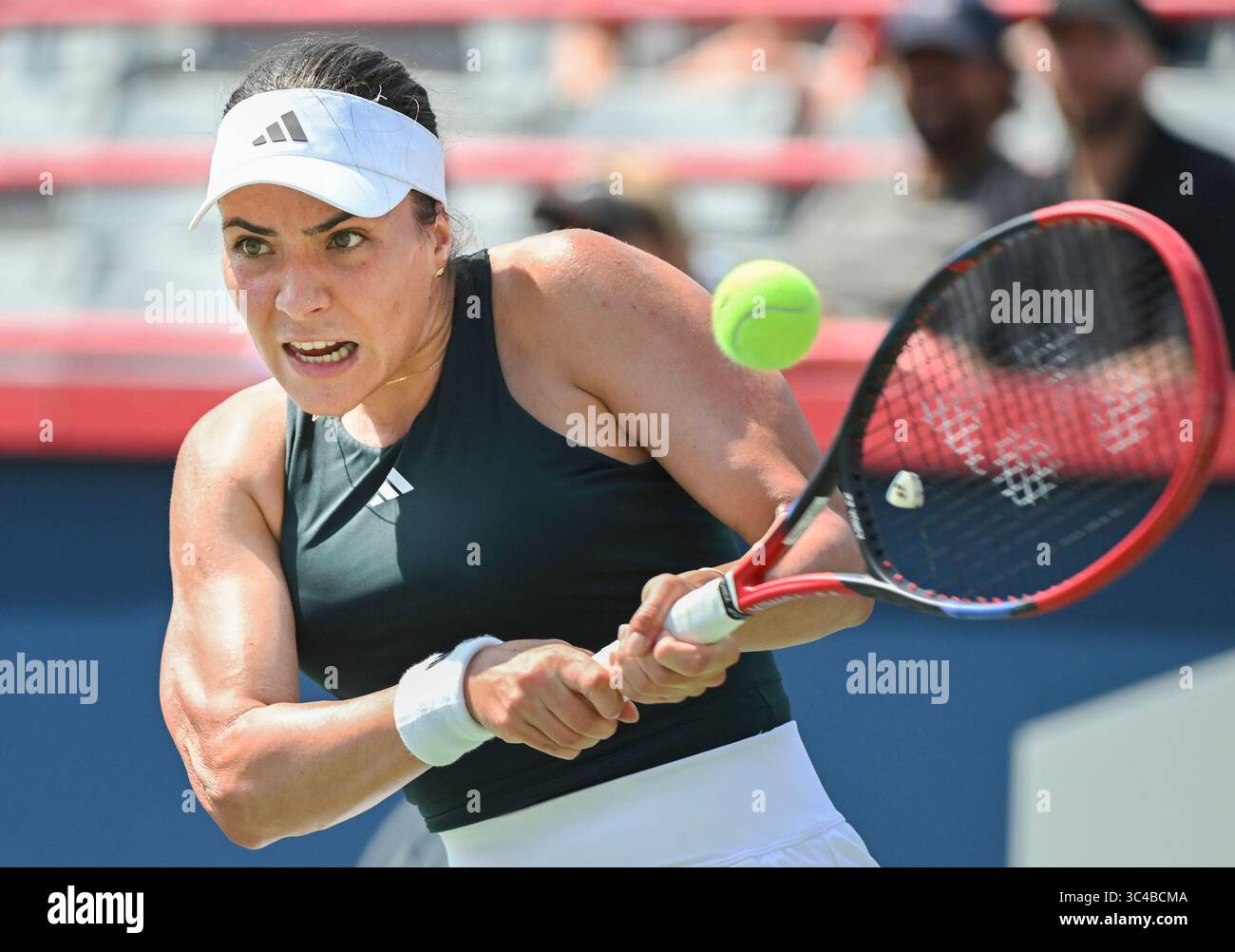 Elena-Gabriela Ruse, of Romania, plays a shot to Emma Raducanu, of the ...