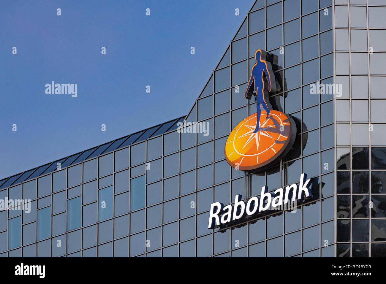 The modern glass facade of a Rabobank building in Utrecht, featuring ...