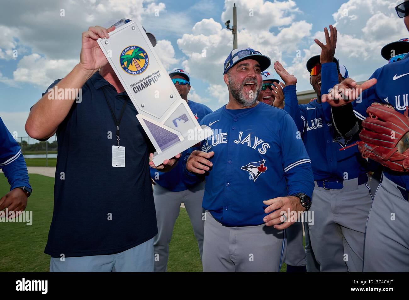 FCL Blue Jays manager John Tamargo (10) is awarded the trophy after ...