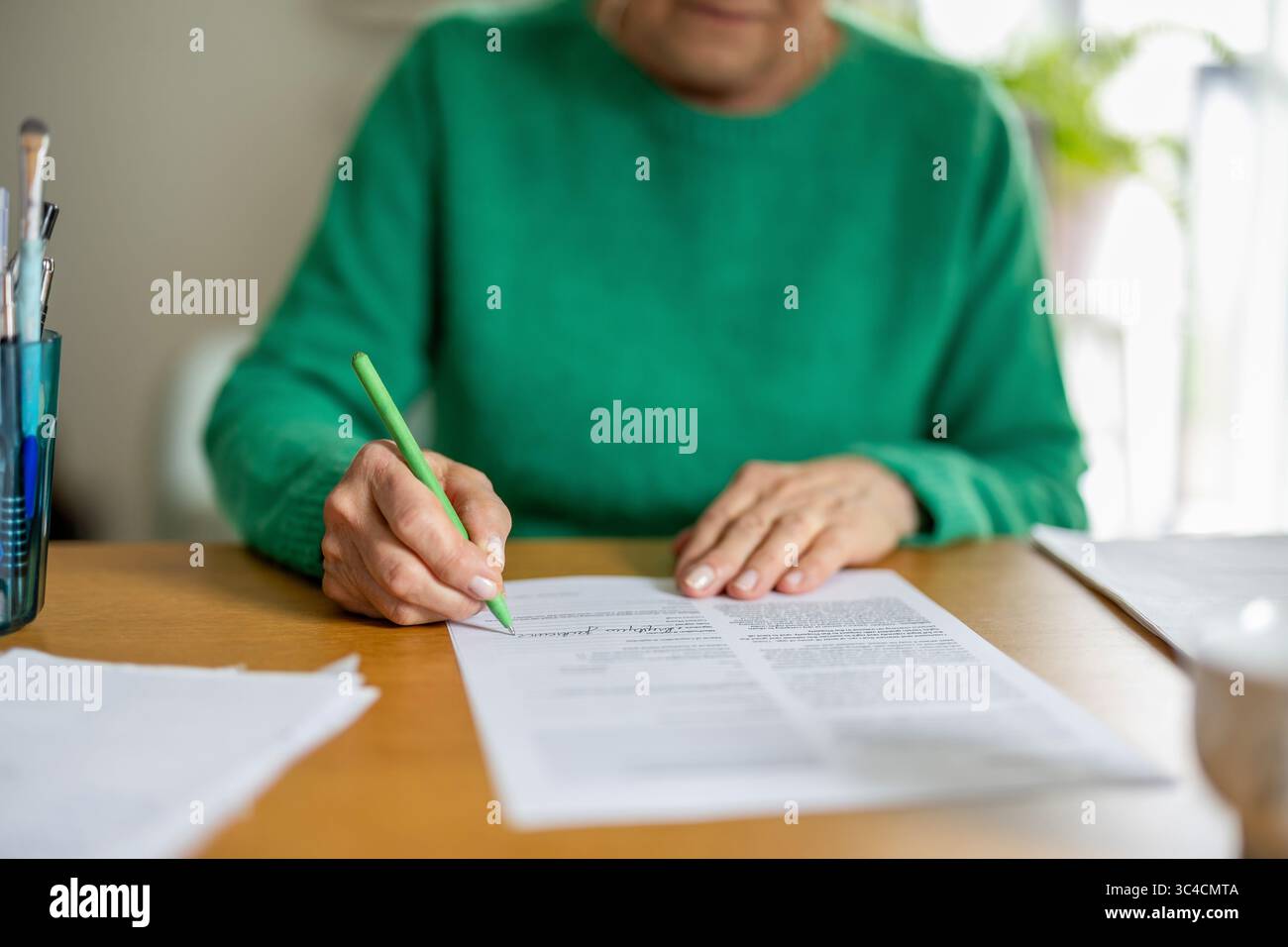Hands document contract retirement hi-res stock photography and images ...