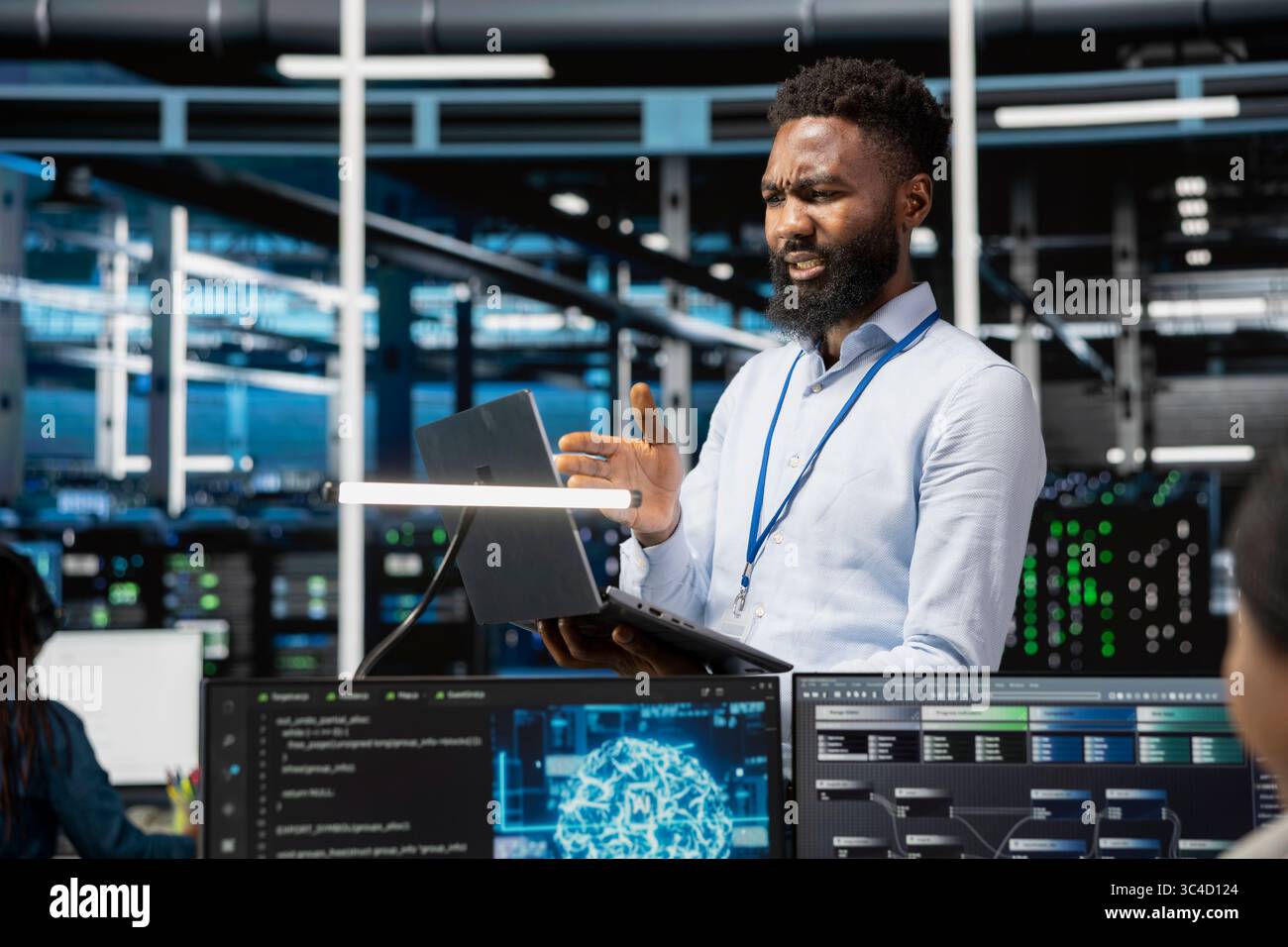 Data center admin using artificial hi-res stock photography and images - Alamy