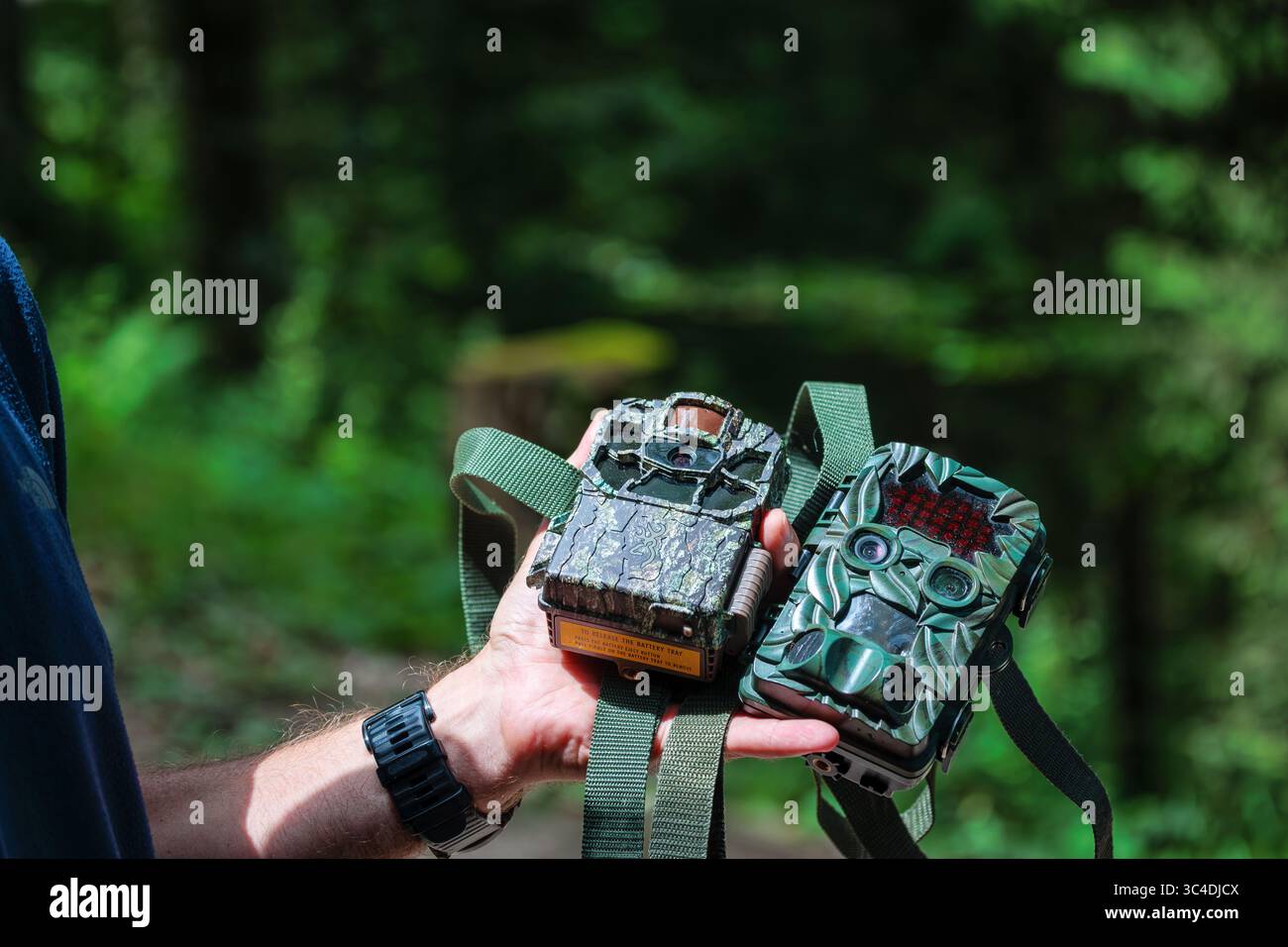Knežak, Slovenia - July 25, 2025: Two different types of camera traps ...