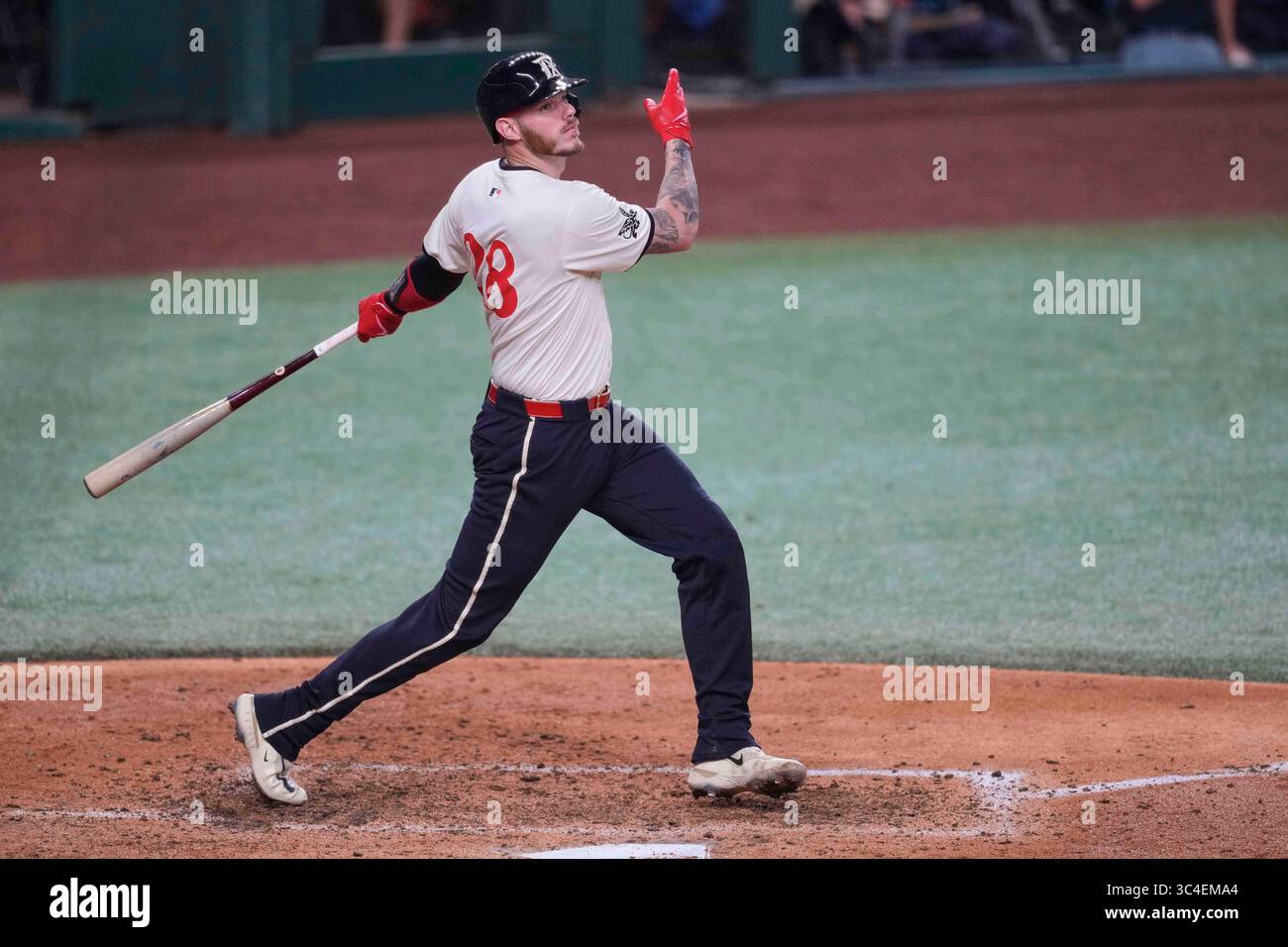 Texas Rangers' Jonah Heim follows through on a swing during a baseball ...