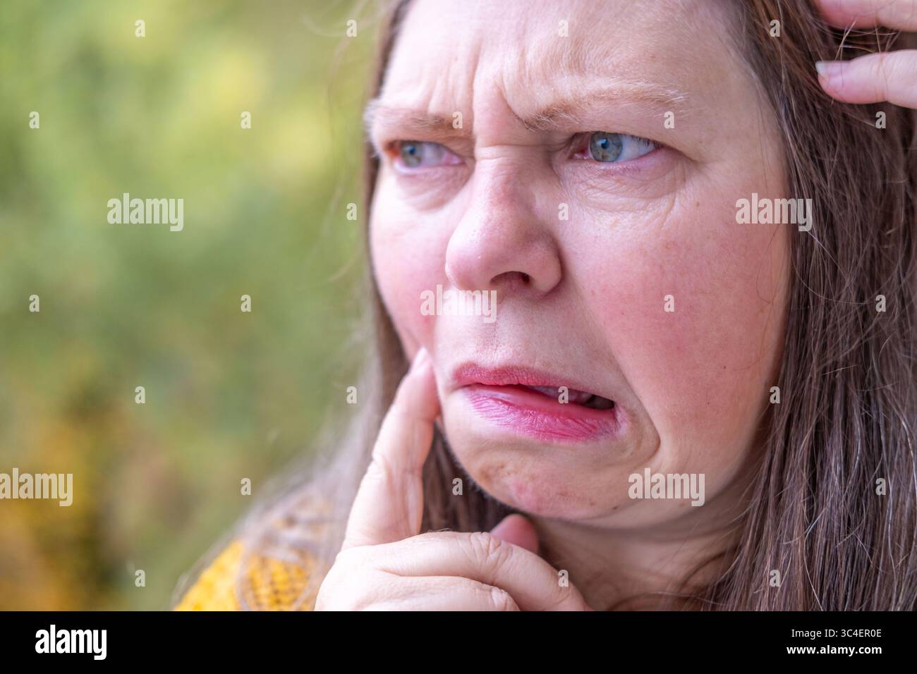 Suffering woman in pain touching jaw, toothache, painful tooth, gum ...