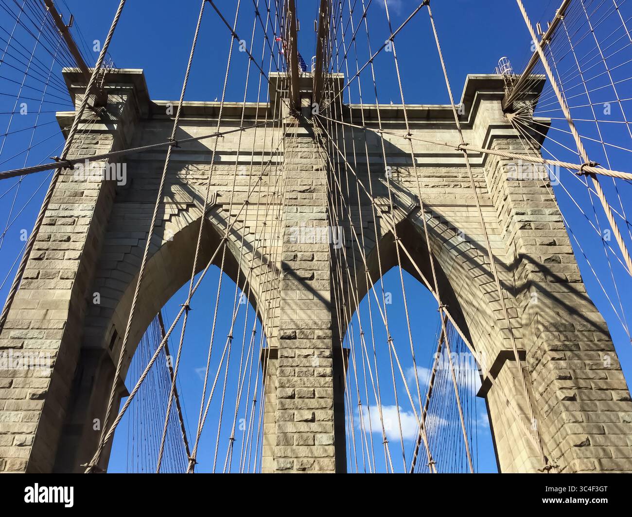 Architectural detail of Brooklyn Bridge’s stone towers and intricate ...