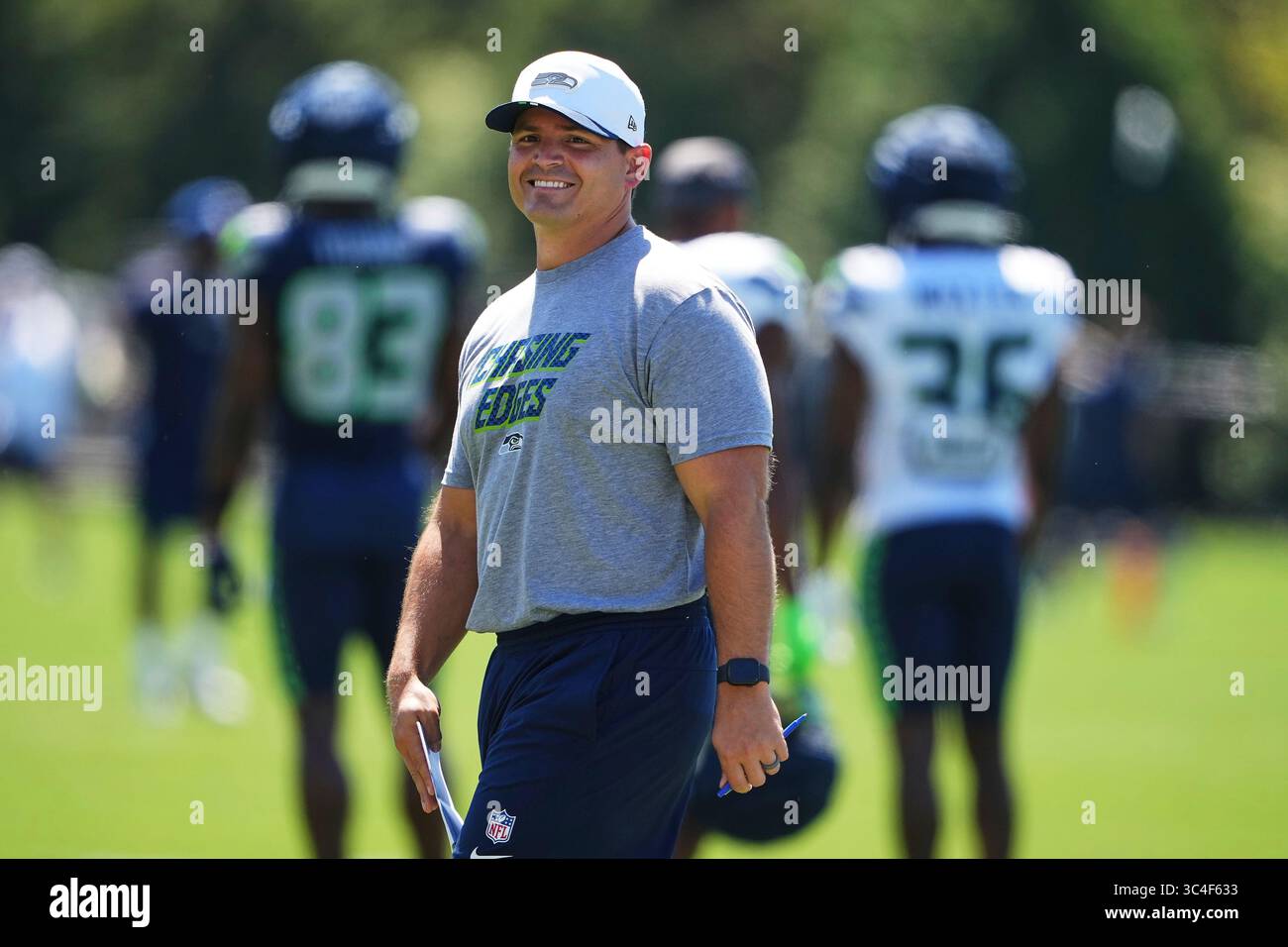 Seattle Seahawks head coach Mike Macdonald smiles during the NFL ...