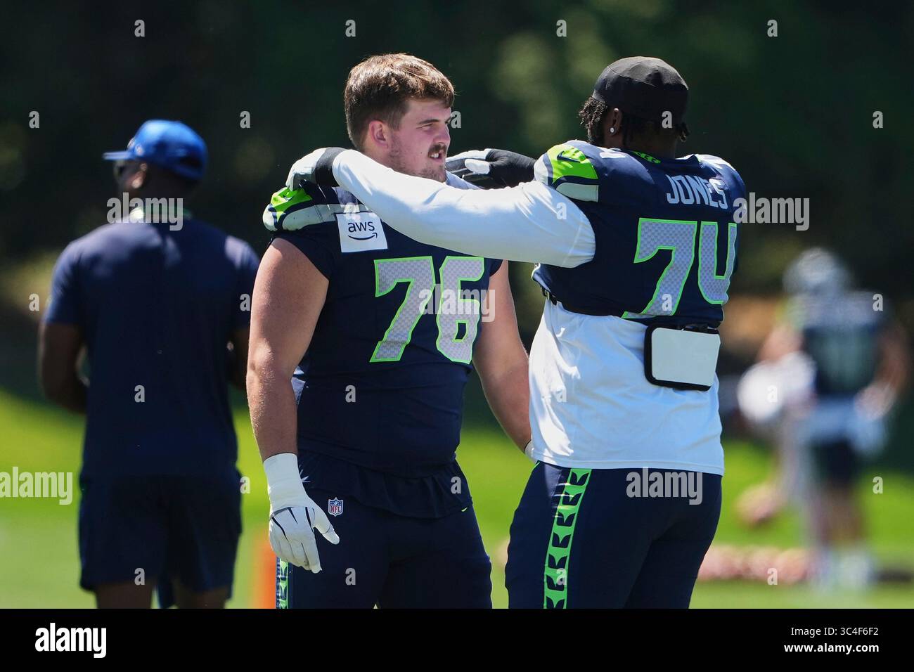 Seattle Seahawks guard Grey Zabel (76) talks with guard Josh Jones (74 ...