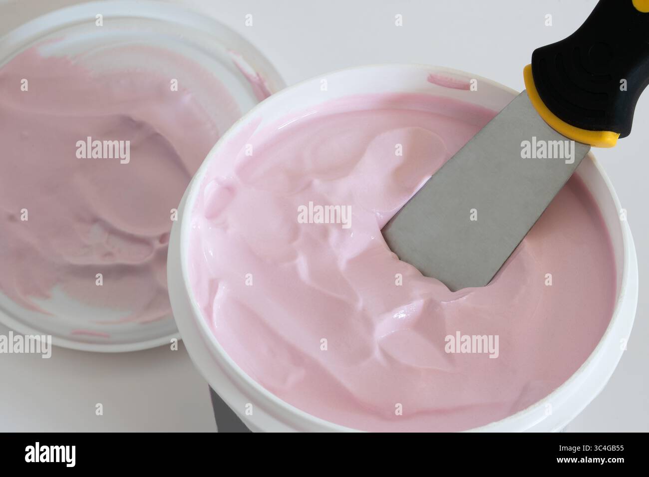 Pink Joint Compound in a Container Stock Photo - Alamy