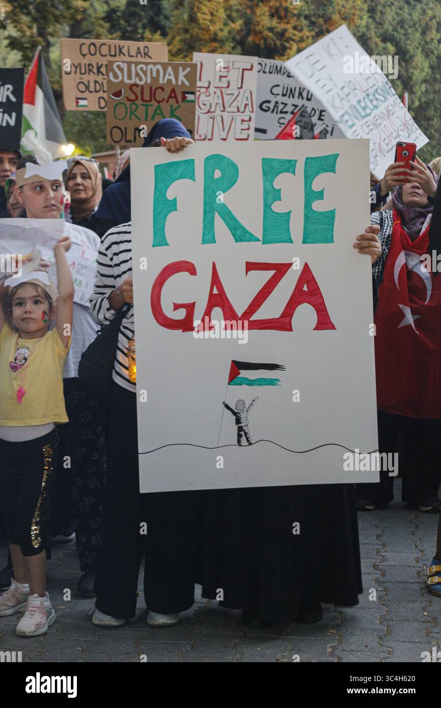 A protester holds a placard that says "Free Gaza" during the protest. A ...