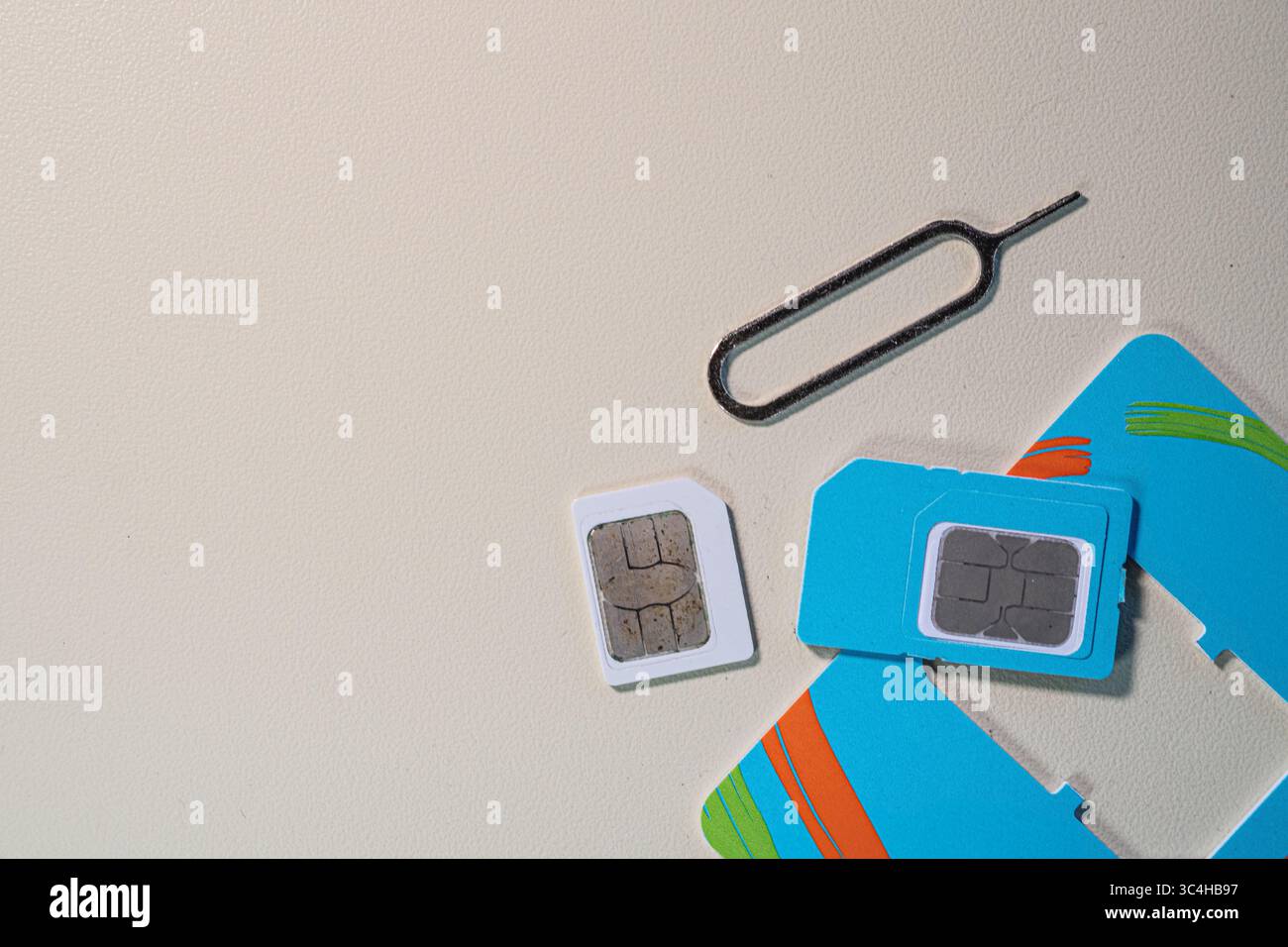 New SIM card popped out from its thin plastic frame, leaving an empty ...