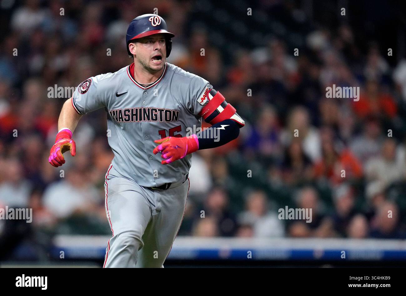 Washington Nationals' Riley Adams runs up the line as he watched his ...