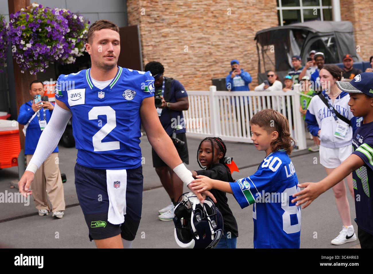 Seattle Seahawks quarterback Drew Lock runs out to the field to greet ...