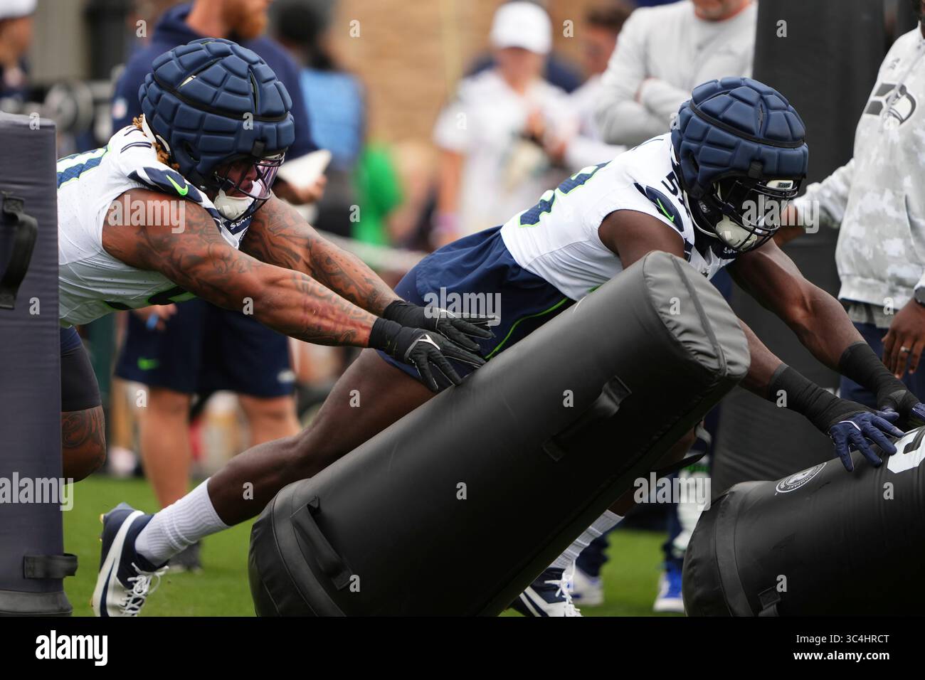 Seattle Seahawks defensive tackle Byron Murphy II, left and linebacker ...