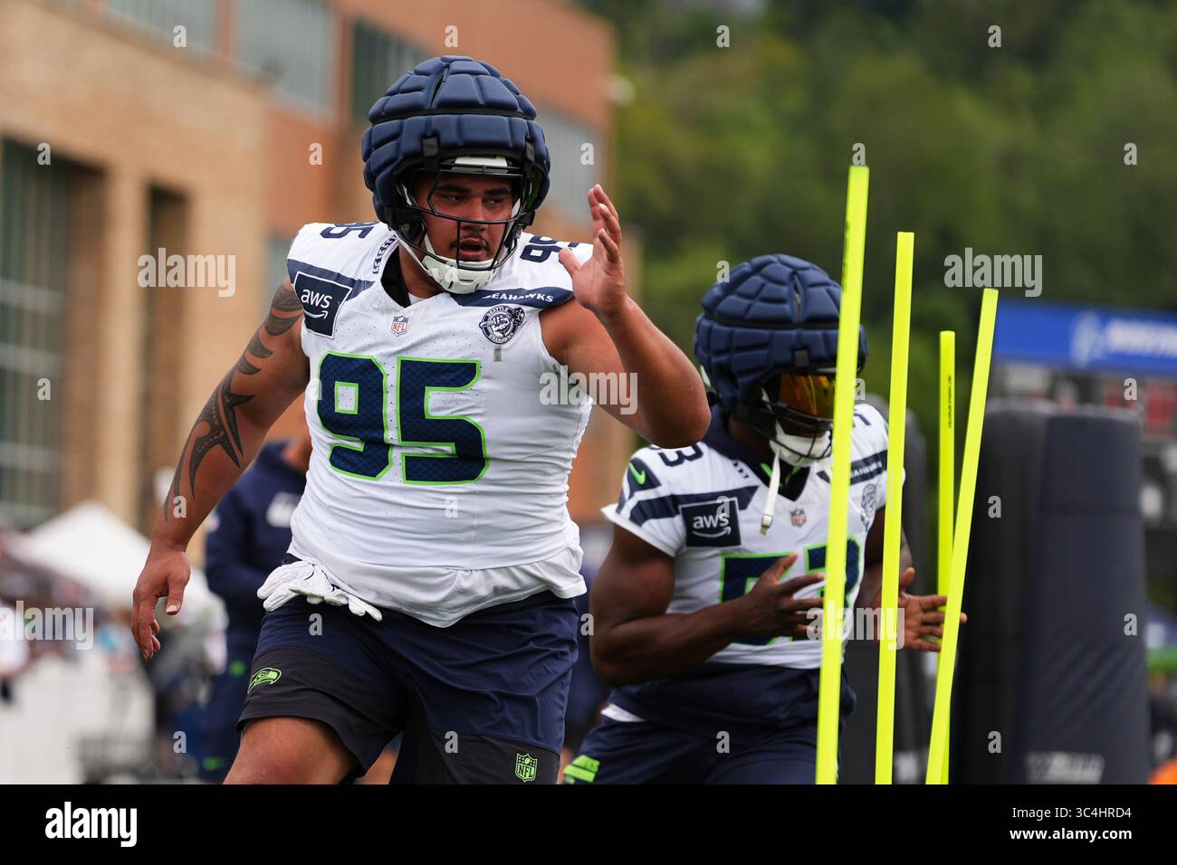 Seattle Seahawks defensive tackle Brandon Pili runs a drill during the ...