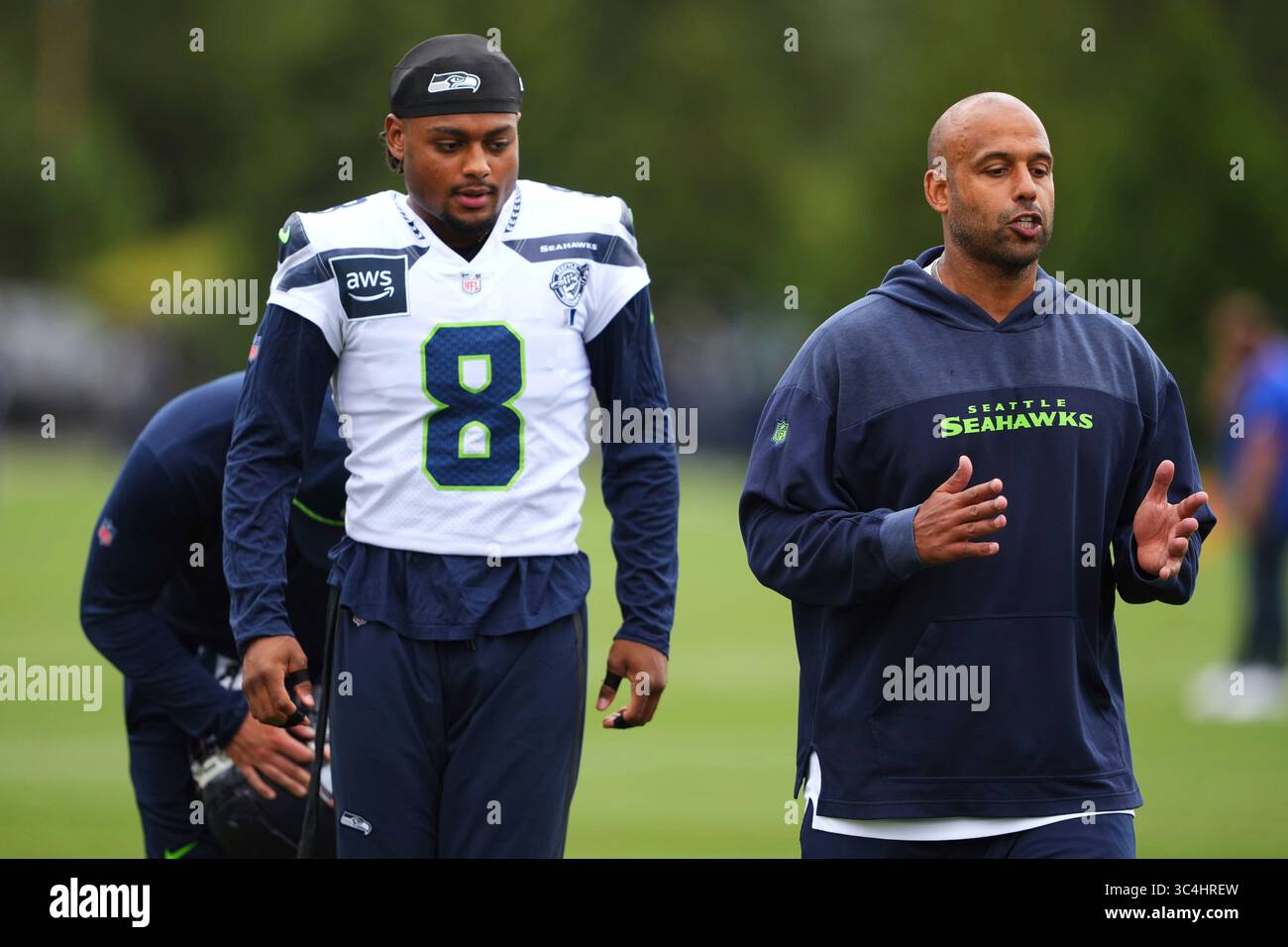Seattle Seahawks safety Coby Bryant receives coaching from defensive ...