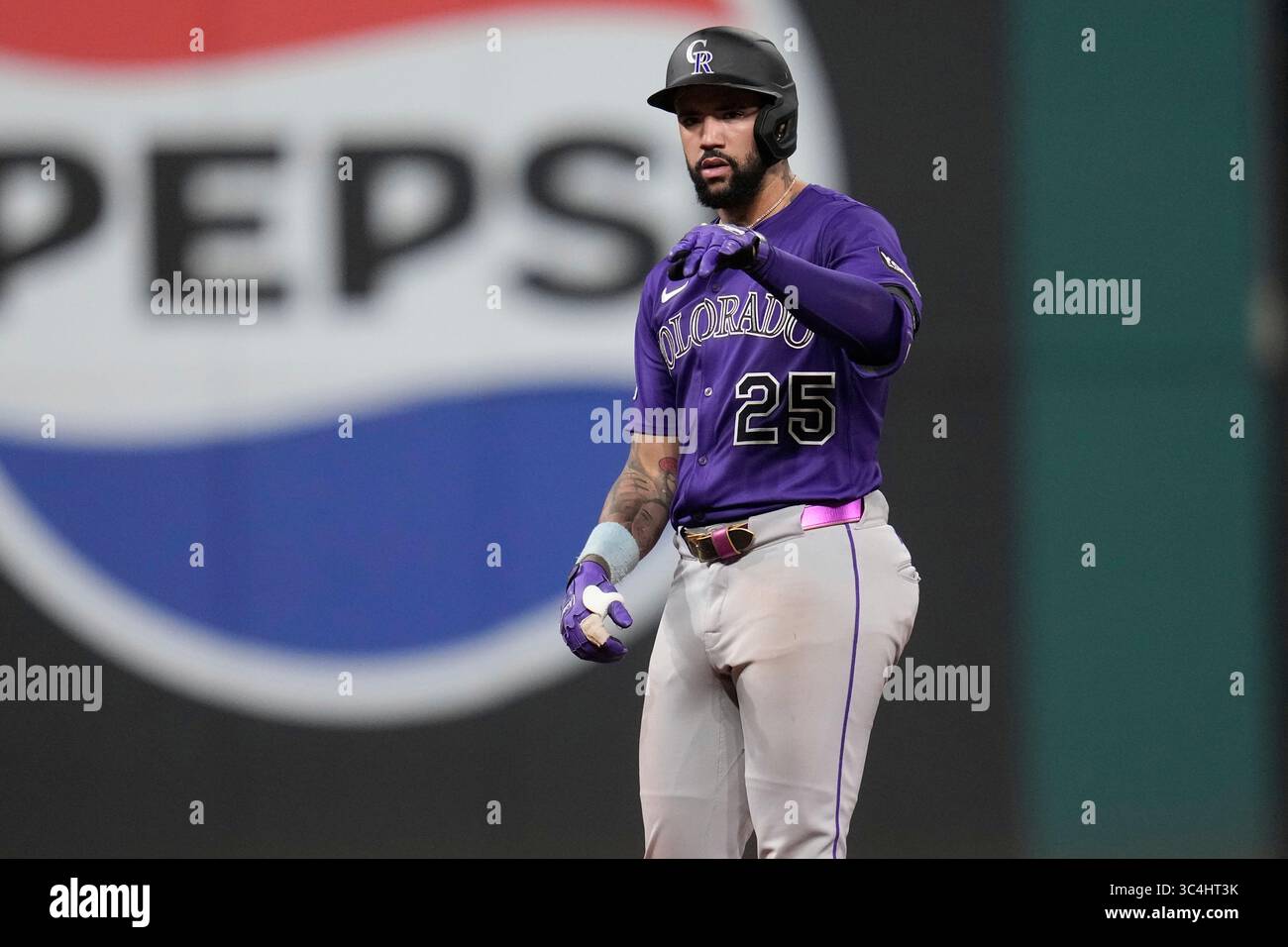 Colorado Rockies' Warming Bernabel (25) gestures from home plate after ...
