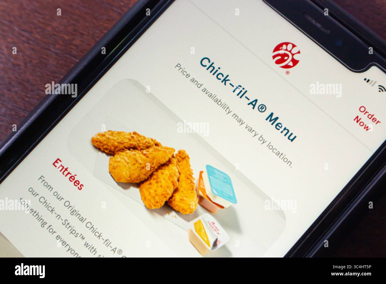 Smartphone displaying Chick-fil-A's mobile menu page featuring crispy ...