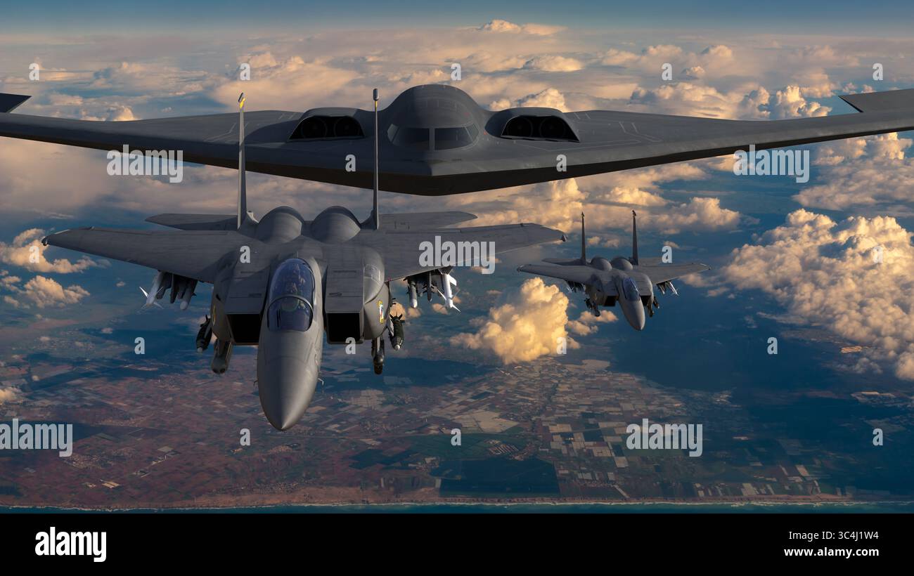 B-2 Spirit bomber escorted by an F-15 Stock Photo - Alamy