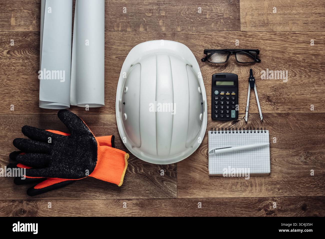 Creative layout of architects with roll drawings, engineering tools and ...